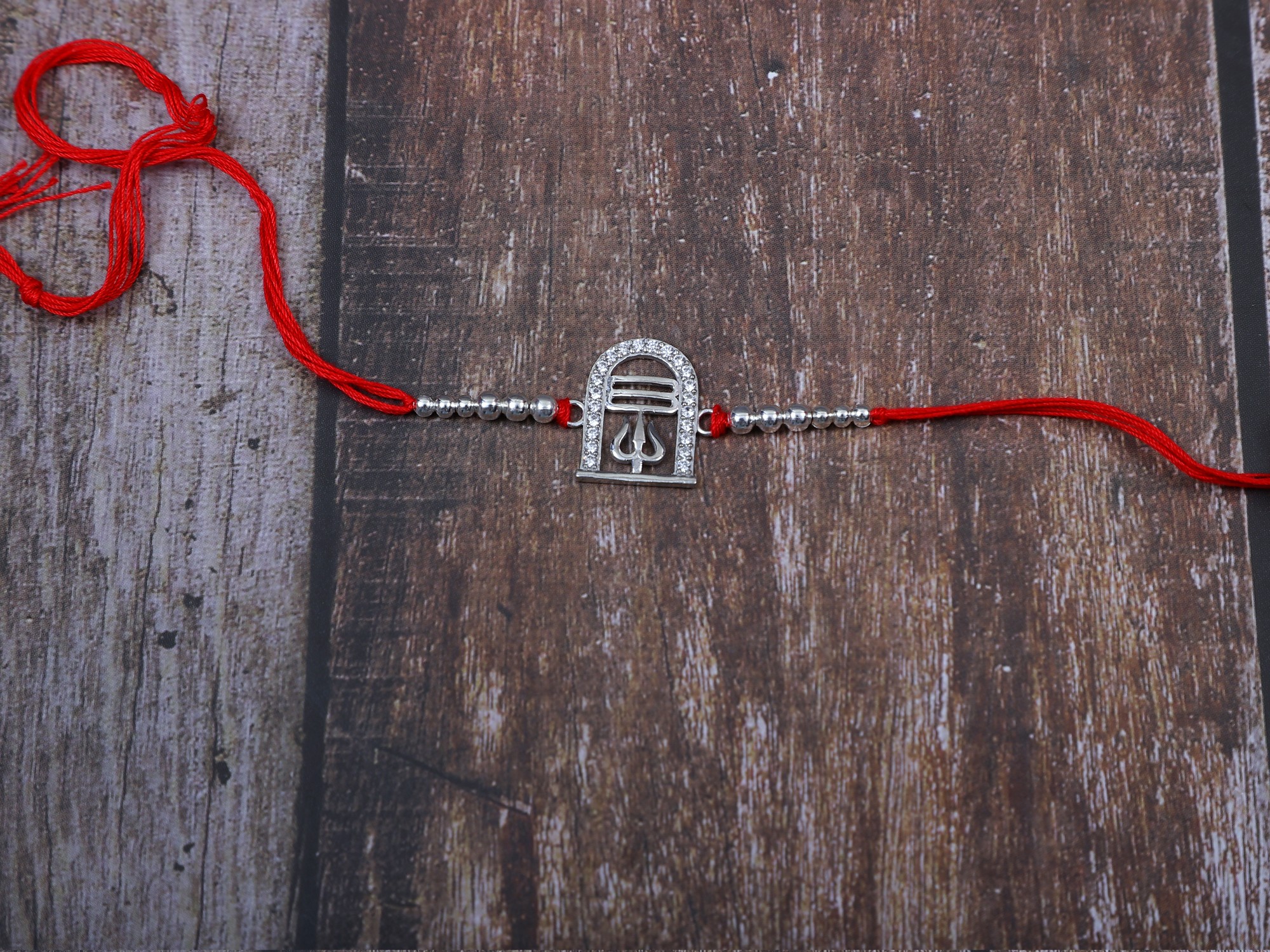 92.5% Sterling Silver Trishul Tripundra Rakhi | Exotic India Art